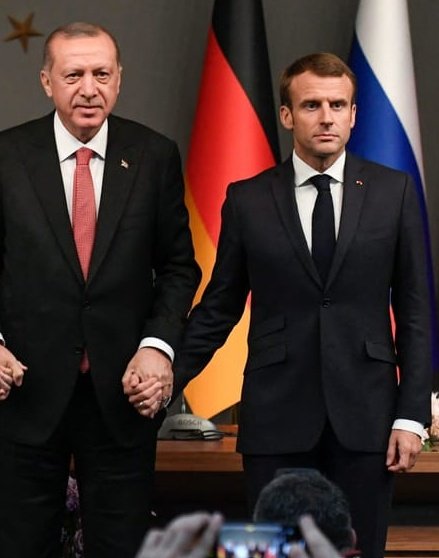 Erdogan Grips Macron’s Finger in Unusual Handshake at Tirana Summit ...